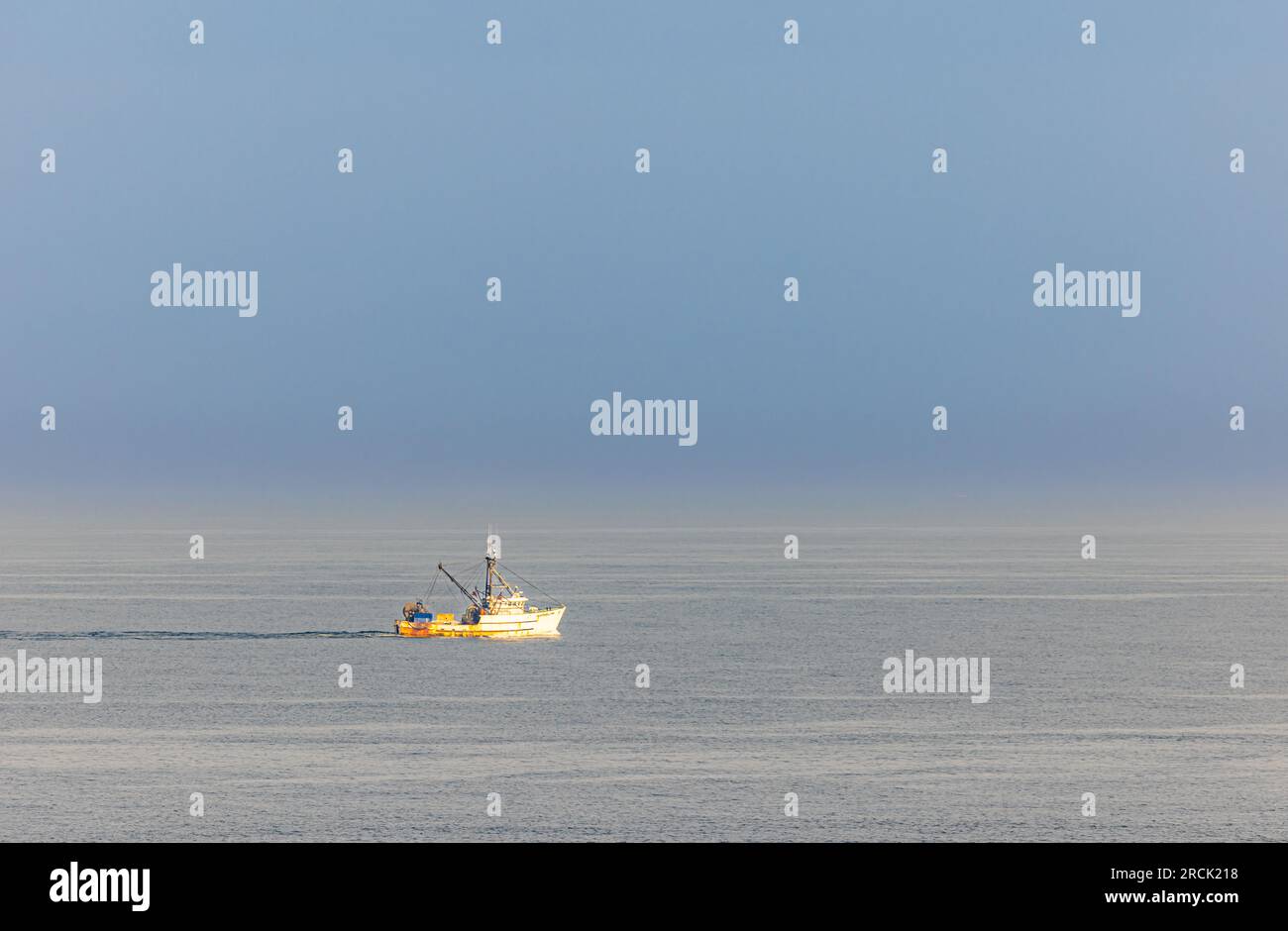 Flat ocean and fishing boat hi-res stock photography and images - Alamy