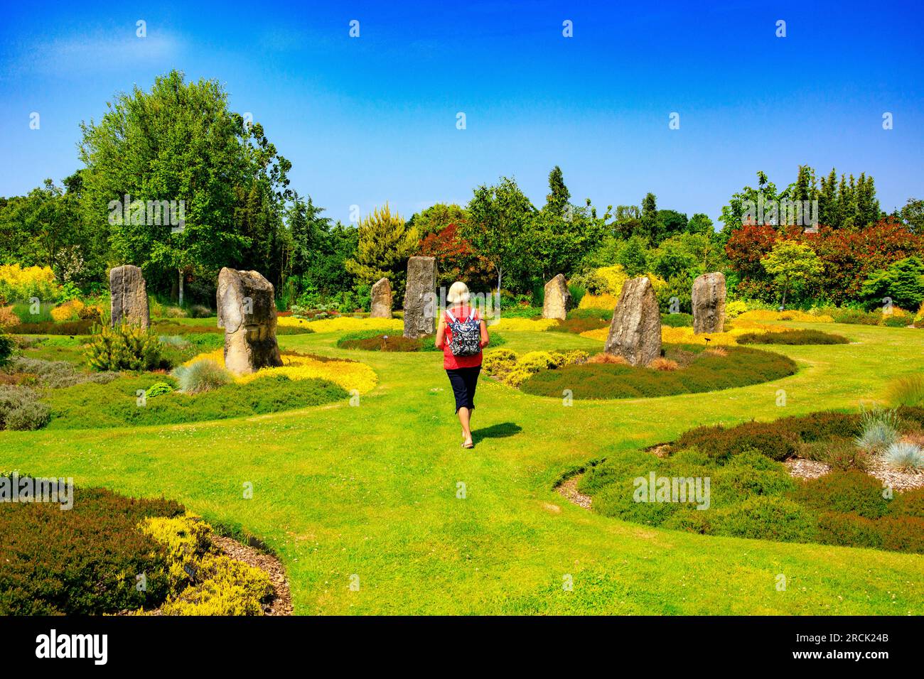 A lady visitor wandering around the ‘Holme Henge’ Purbeck stone ...