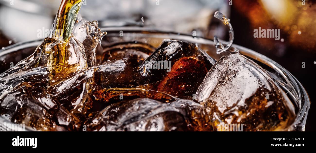 Splashing of Cola and Ice. Cola soda and ice splashing fizzing or ...