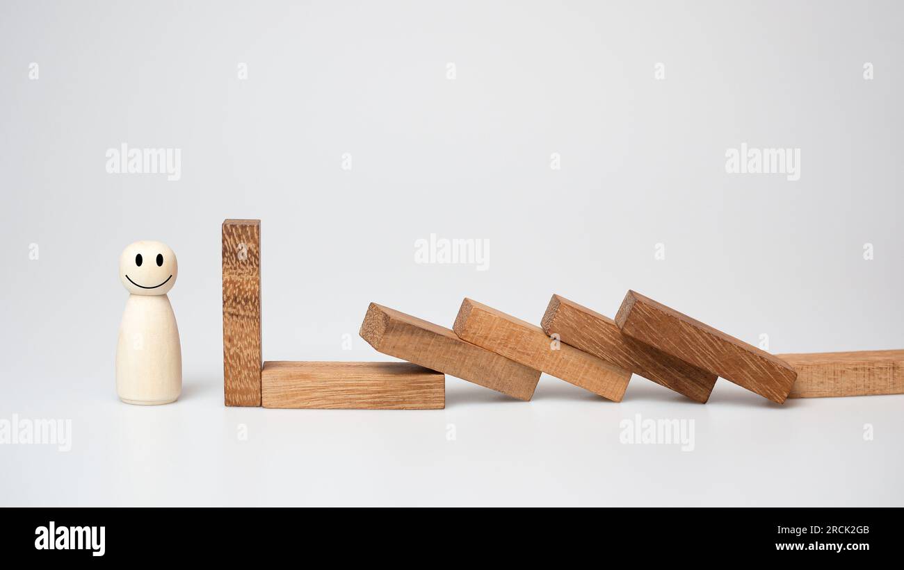 Risk management concept. Wooden block stopping dominoes effect for ...
