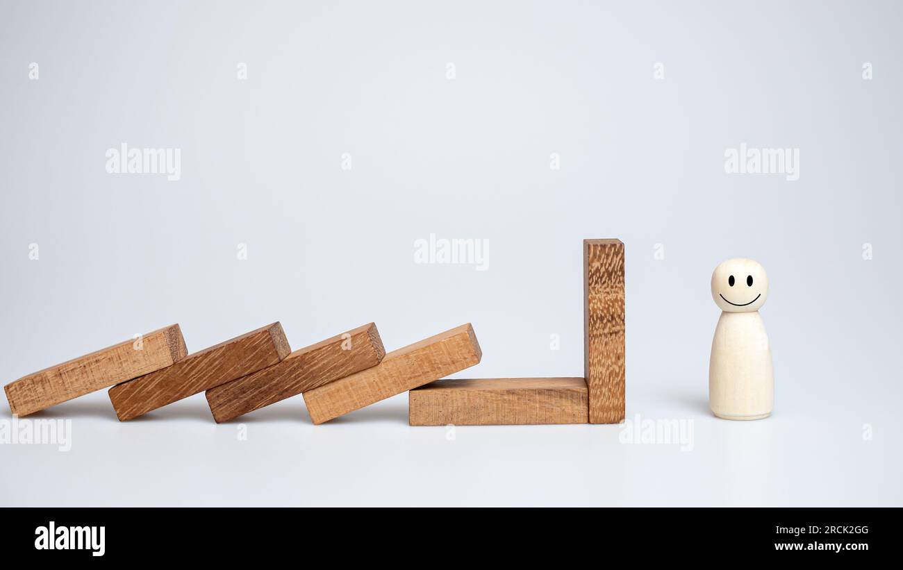 Risk management concept. Wooden block stopping dominoes effect for ...