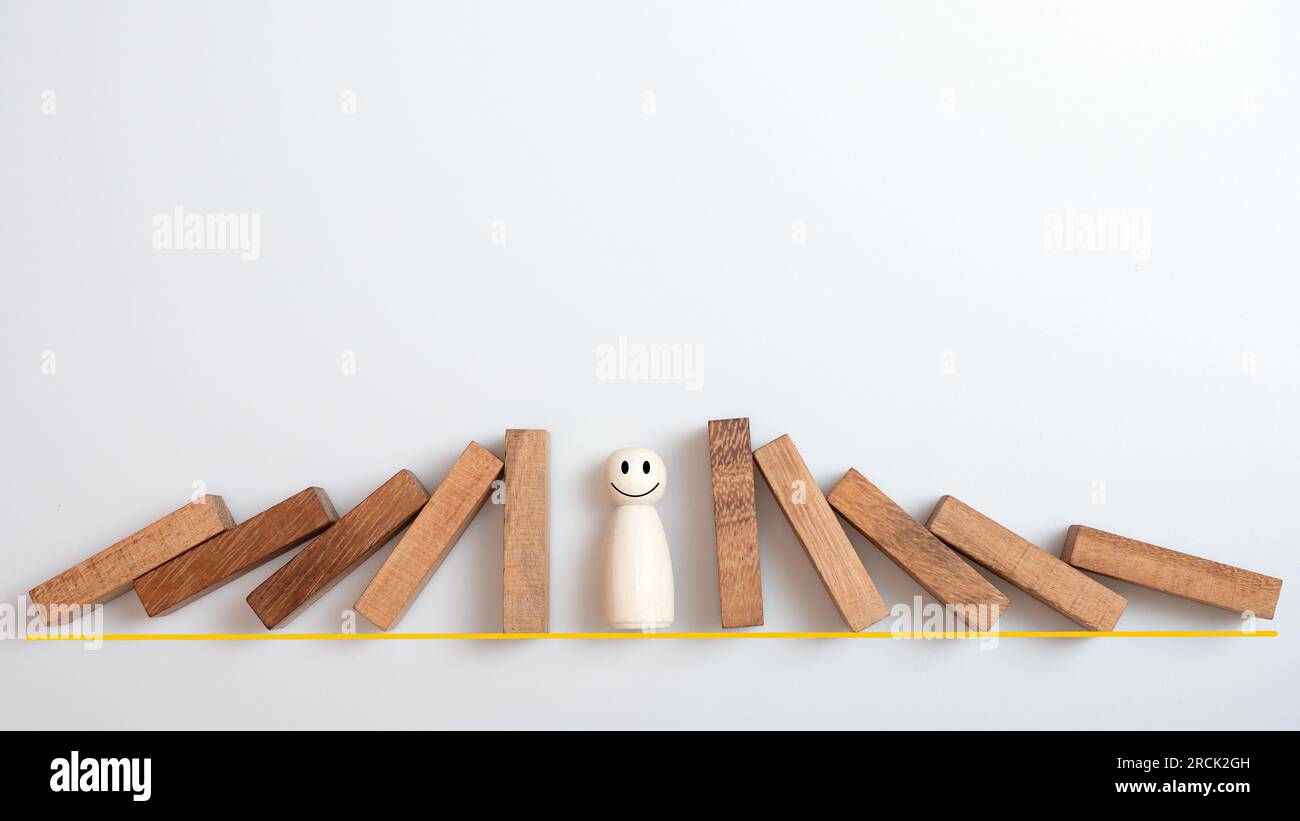 Risk management concept. Wooden block stopping dominoes effect for ...