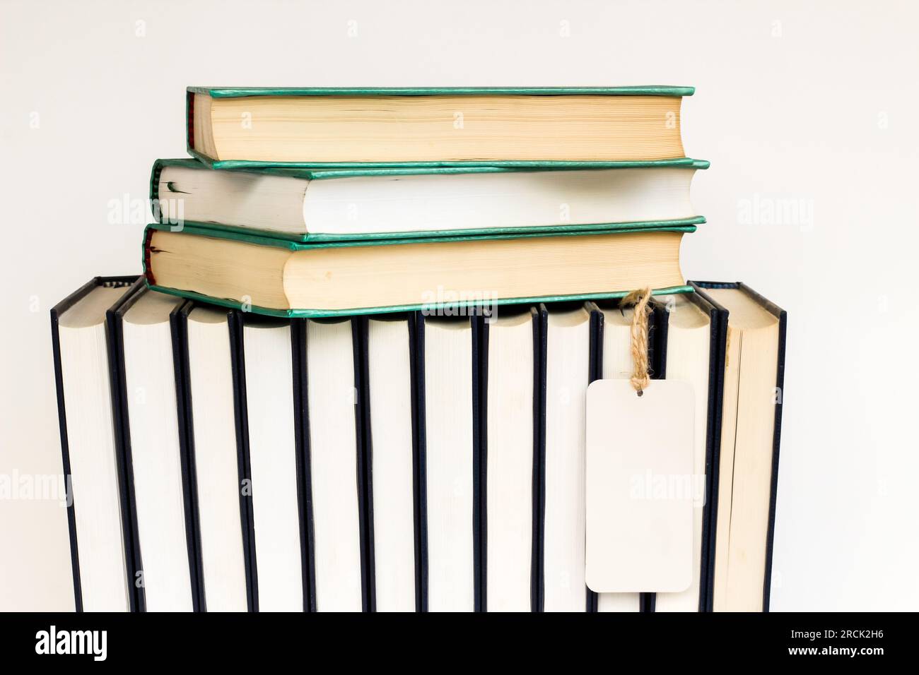 Hard cover books,encyclopedia series lined up on white with copy space ...