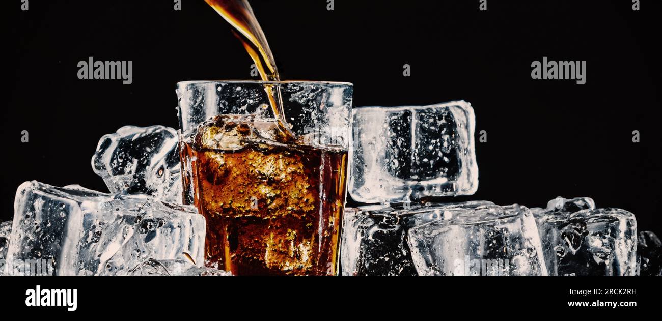 Splashing of Cola and Ice. Cola soda and ice splashing fizzing or ...