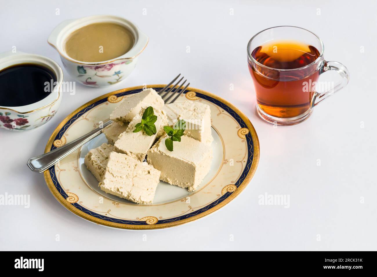 Traditional Turkish grape molasses, tahini and plain halva group ...
