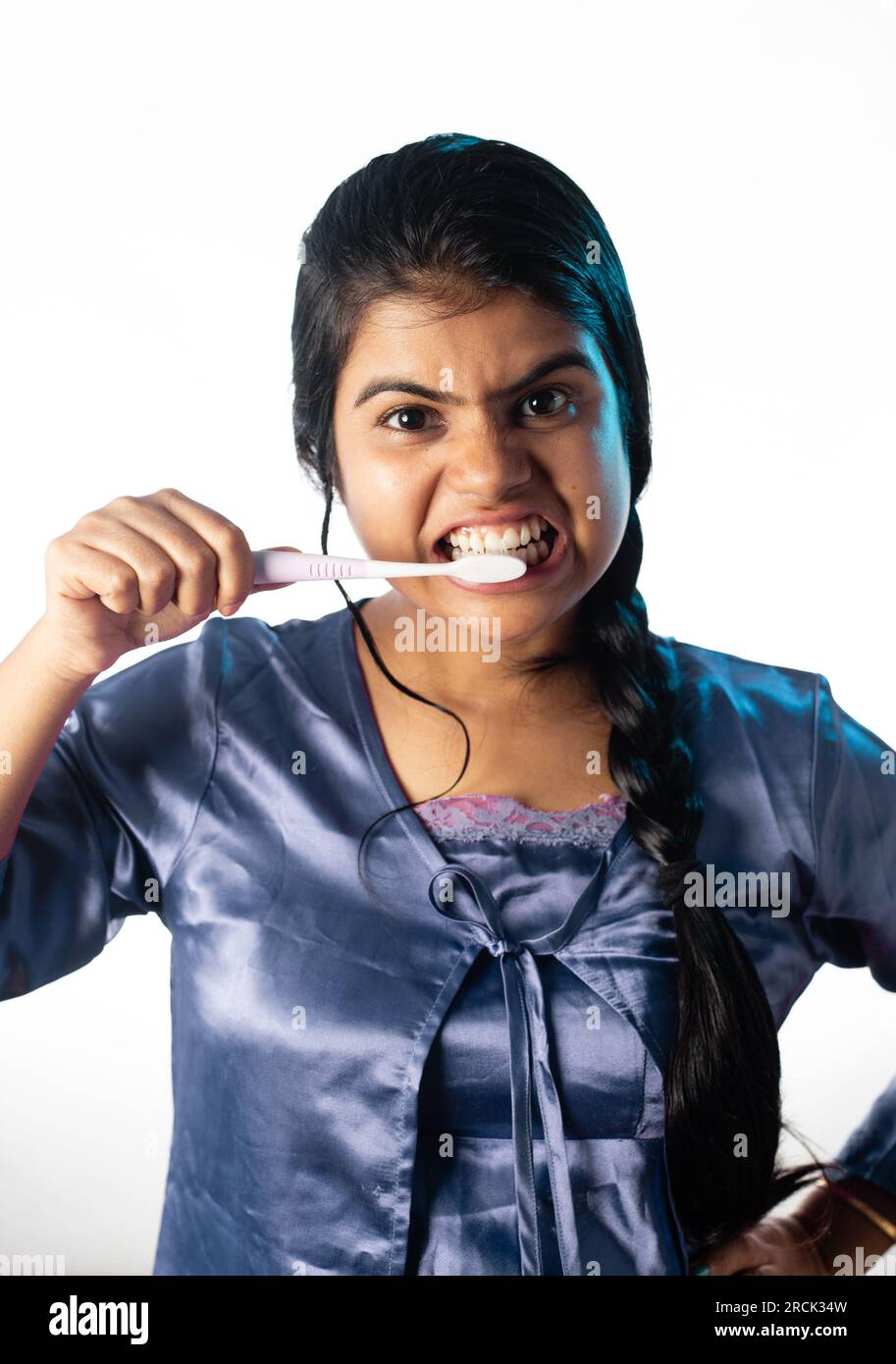 An Indian woman female girl showing tooth brush on white background ...