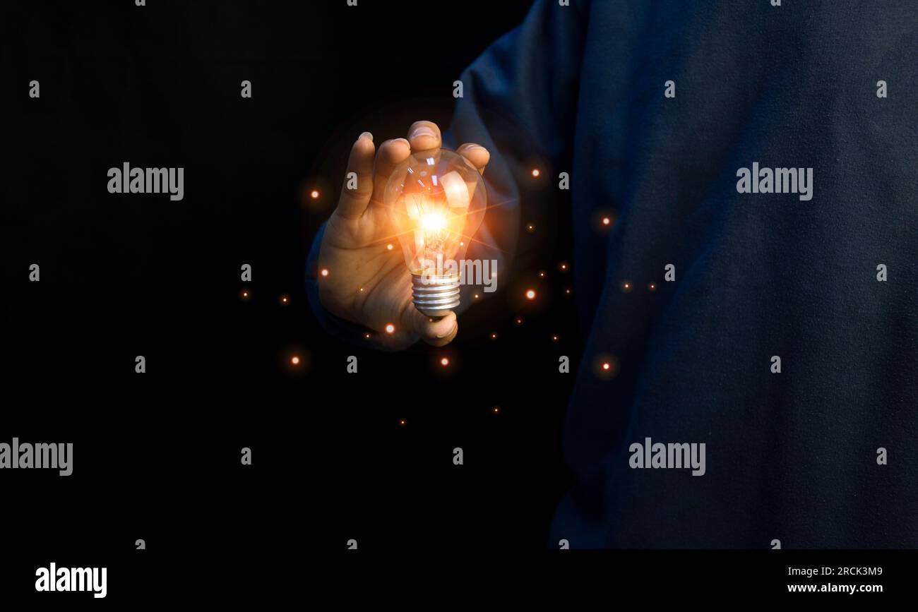 People holding light bulbs hi-res stock photography and images - Alamy