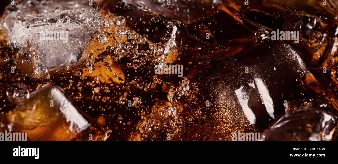 Splashing of Cola and Ice. Cola soda and ice splashing fizzing or ...