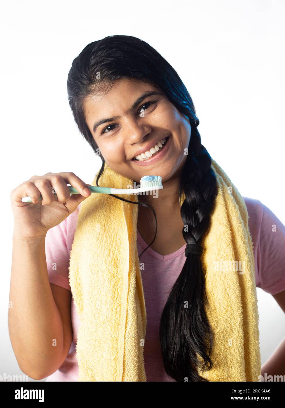 An Indian woman female girl brushing teeth on white background with ...