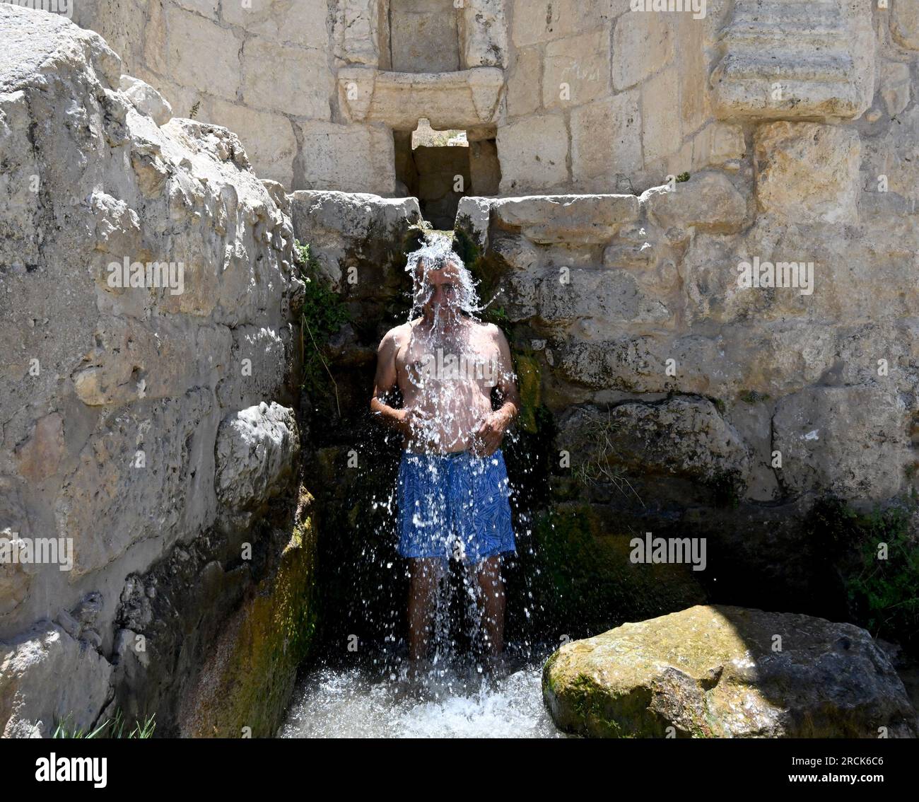 Haniya Spring, West Bank. 15th July, 2023. An Israeli cools off in a ...