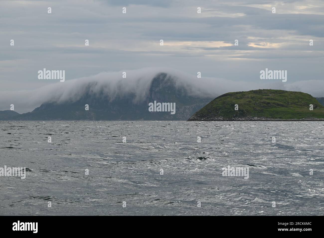 Bad weather coming, fog is rolling in from the sea over the mountain ...