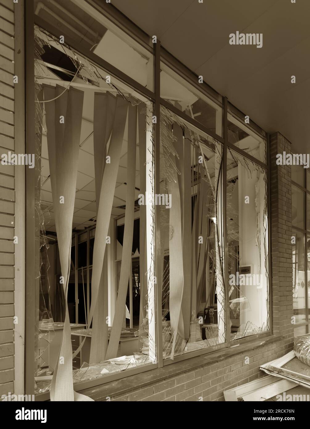 Broken windows of civilian building of bomb explosion. Shards of glass ...