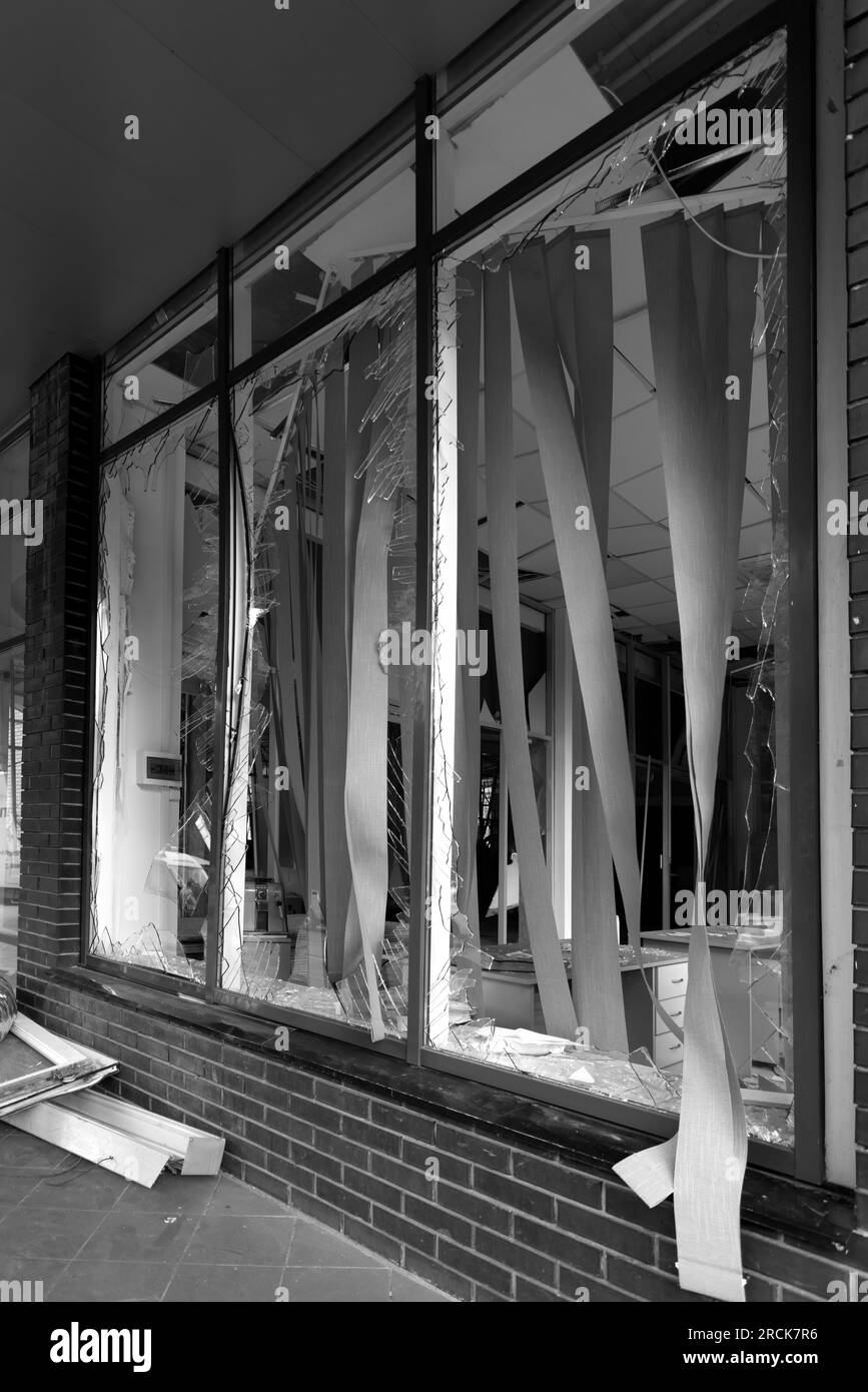 Broken windows of civilian building of bomb explosion. Shards of glass ...