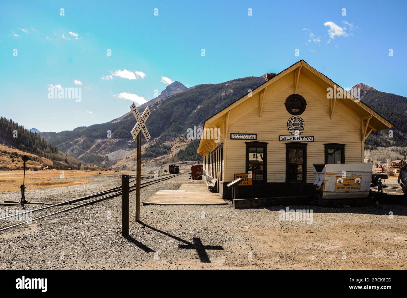 Historic train station in Silverton, Colorado, with rocky mountains in ...