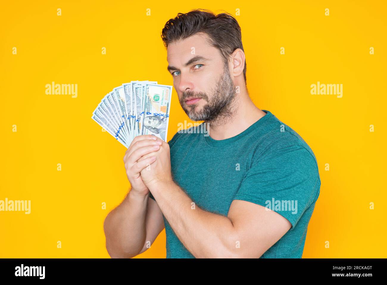Business man counting money. Handsome middle age man holding bunch of ...