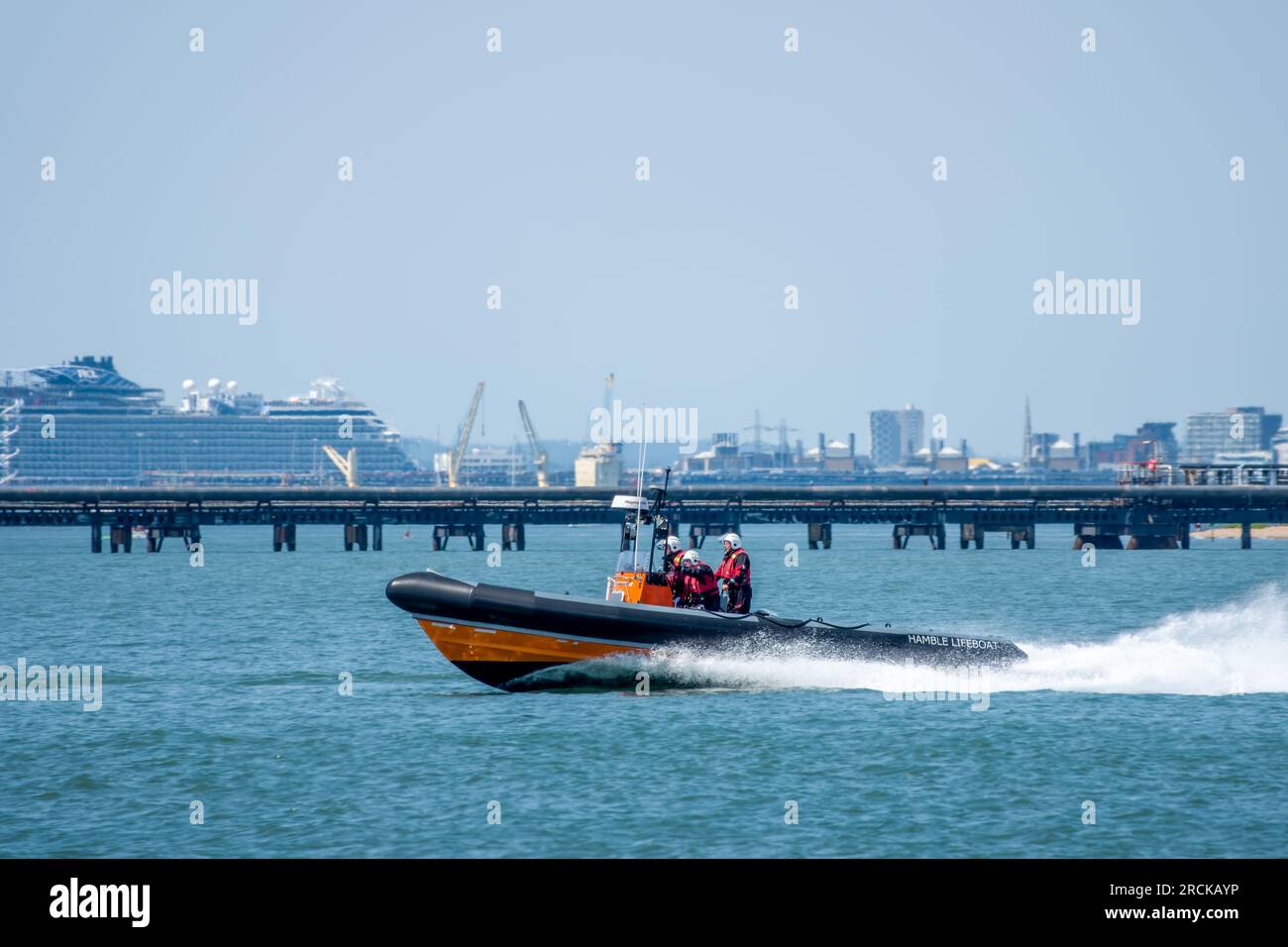 Hamble Lifeboat in action in Southampton Water with a cruise liner in ...