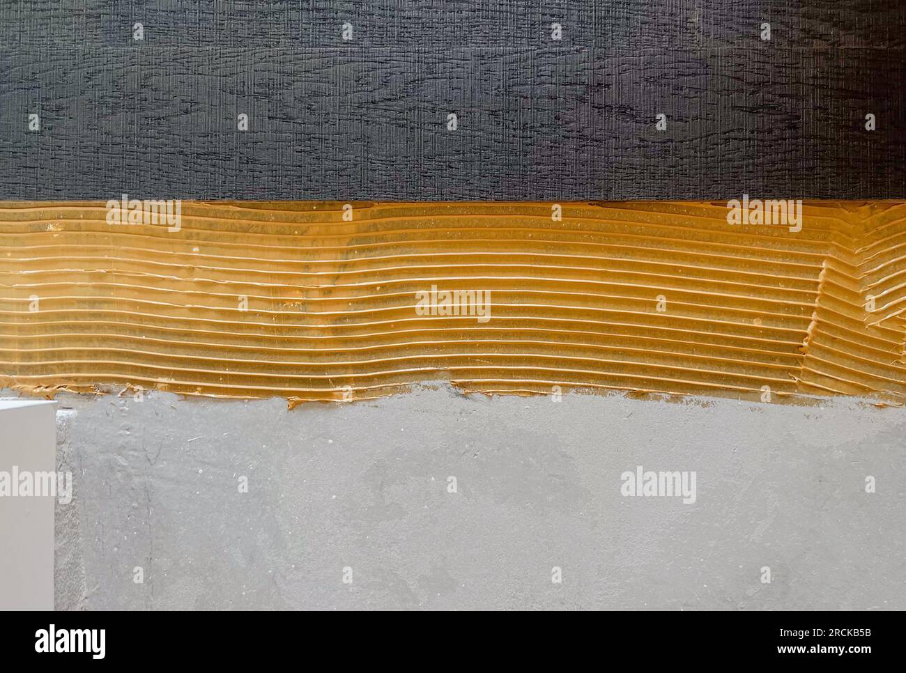 workers apply parquet glue to lay the Listone Giordano Stock Photo - Alamy