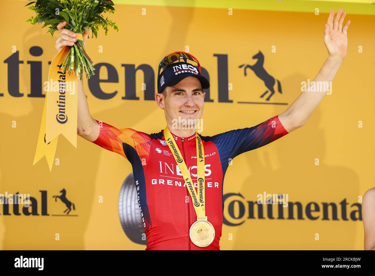 Spanish Carlos Rodriguez of Ineos Grenadiers celebrates on the podium ...