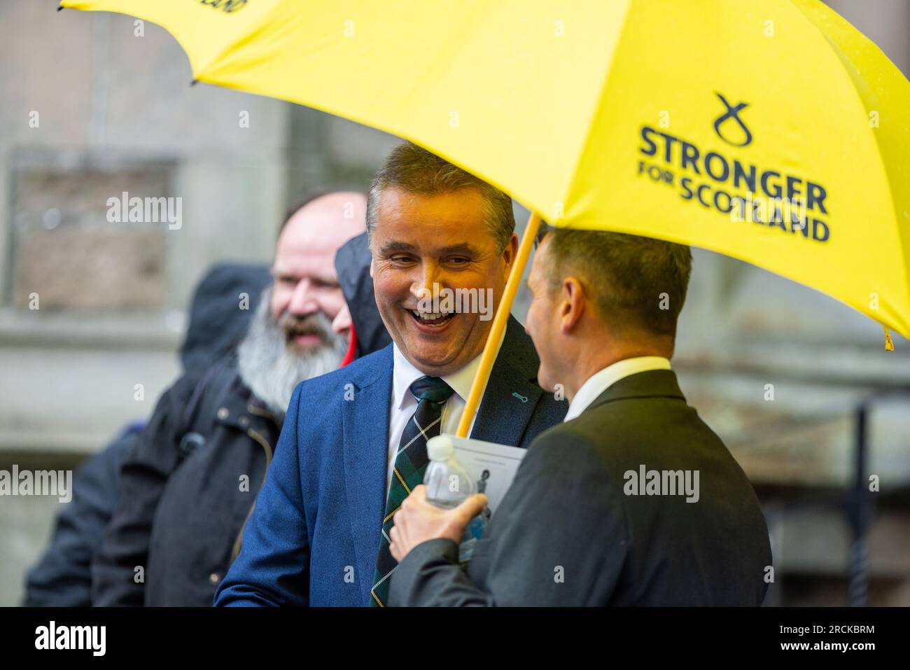 MP, Angus MacNeil (centre) leaves following a memorial service at ...