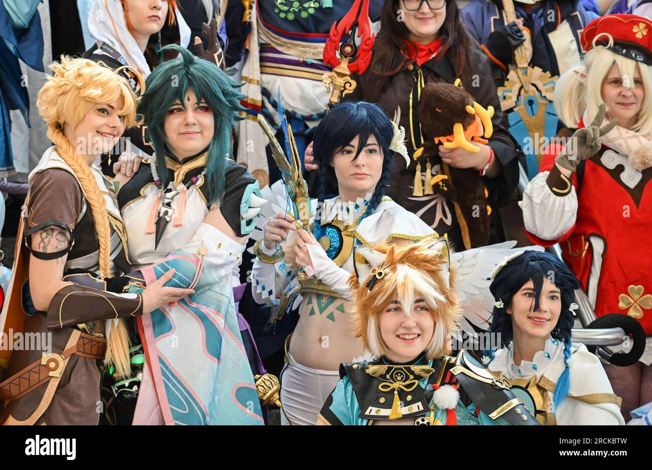 Characters from the video game Genshin Impact pose at Comiccon in ...