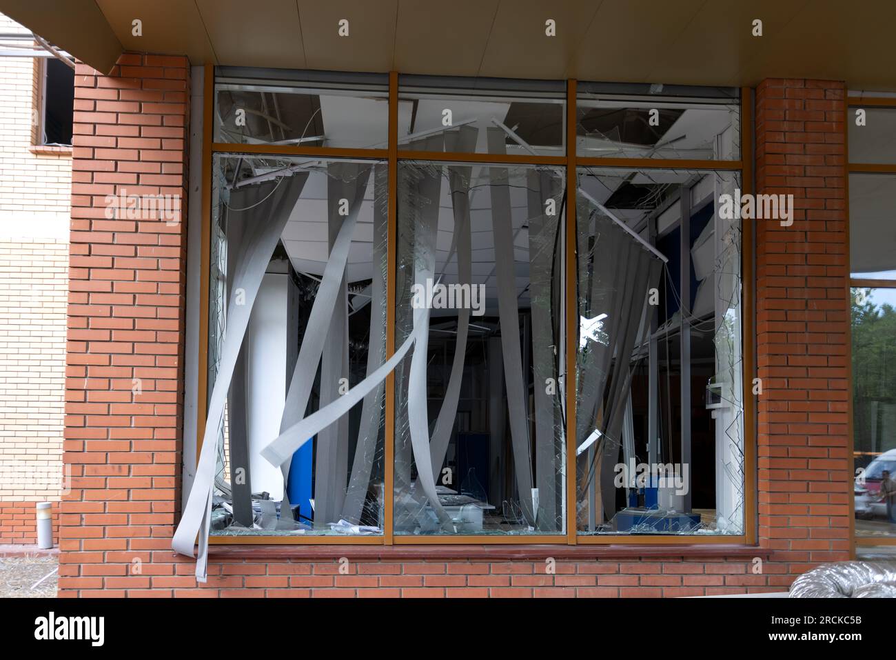 Broken windows of civilian building of bomb explosion. Shards of glass ...