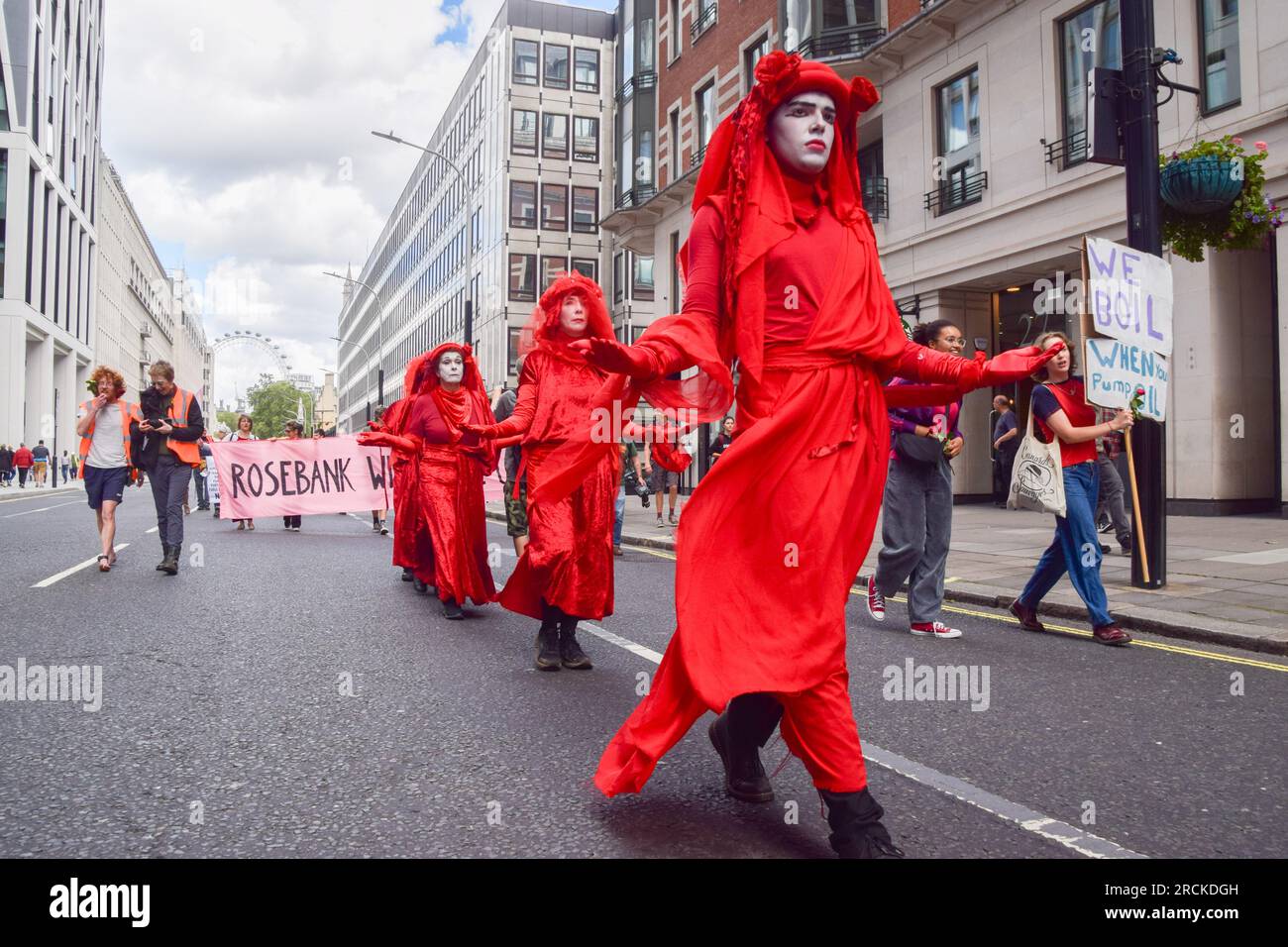 London, UK. 15th July 2023. Extinction Rebellion's Red Rebels join the ...