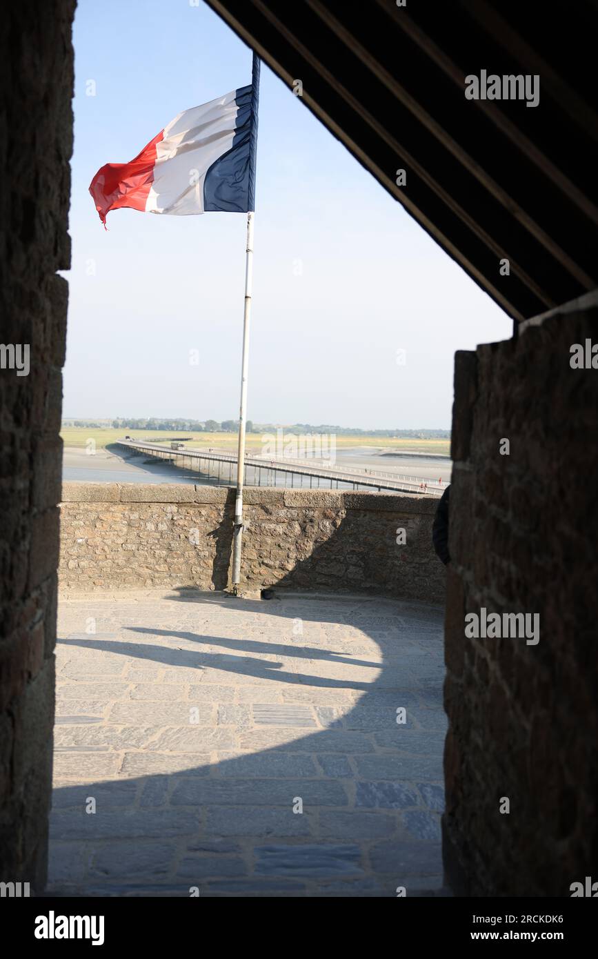 A French flag waving in the wind after wrapping itself around it's pole ...
