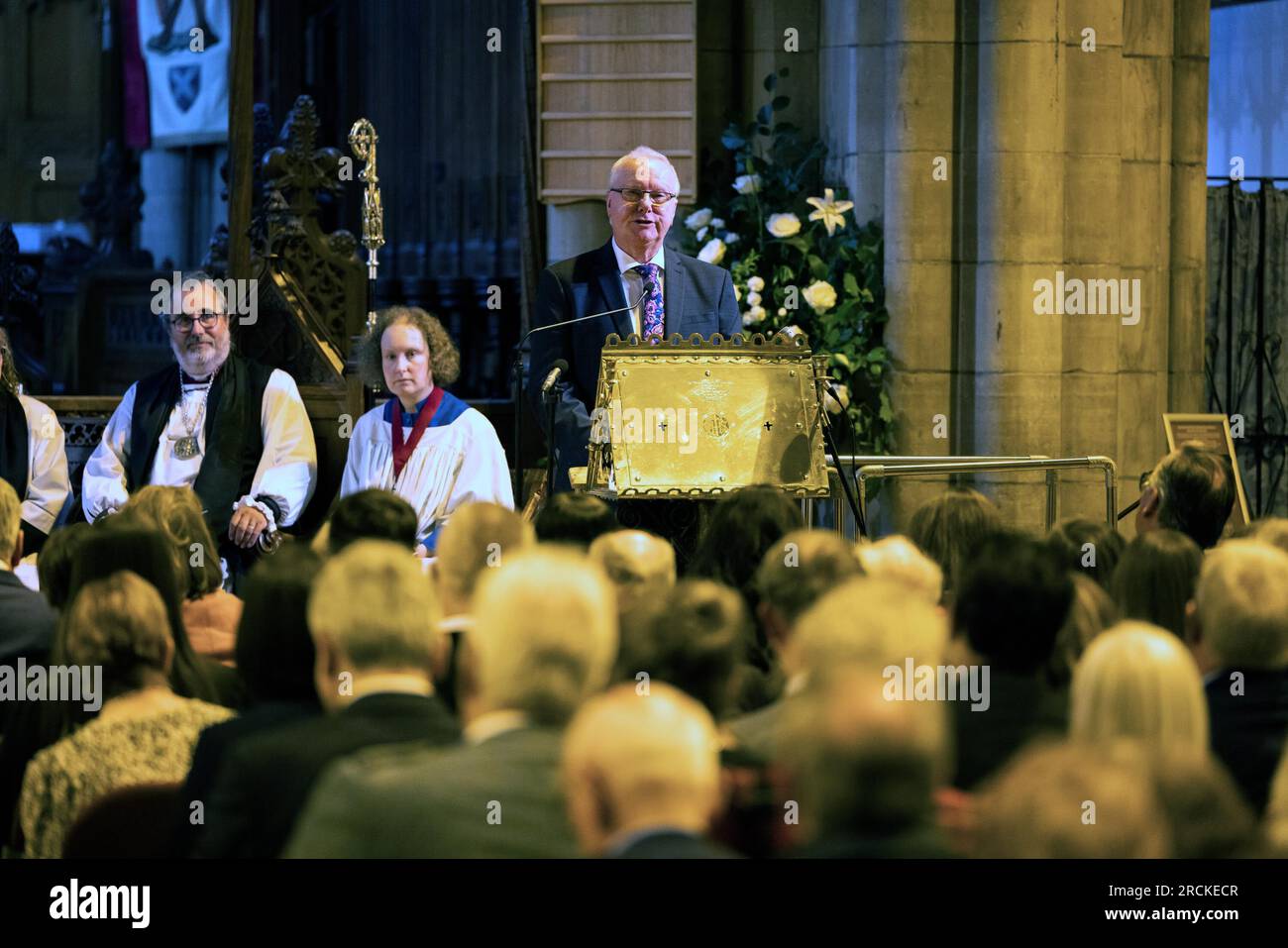 MSP, Alex Neil, reads the second eulogy, during a memorial service at ...