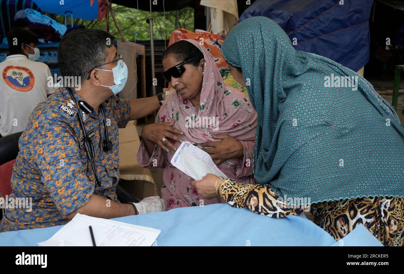 New Delhi, India. 15th July, 2023. A doctor of National Disaster Response Force (NDRF) attends ...