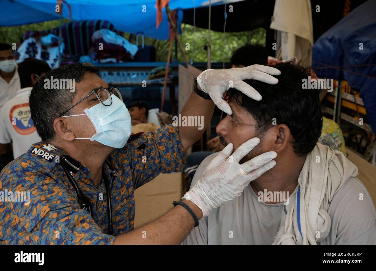New Delhi, India. 15th July, 2023. A doctor of National Disaster Response Force (NDRF) attends ...