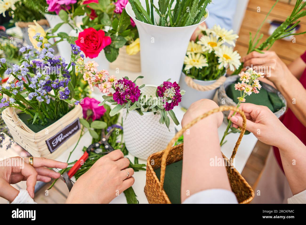 Master class on making bouquets. Spring bouquet in wicker basket ...