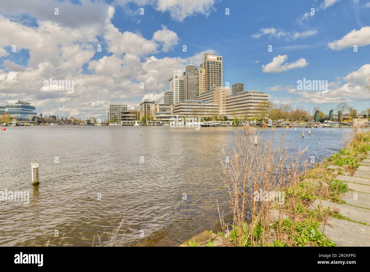 some buildings and water in the middle of a large body of water with ...