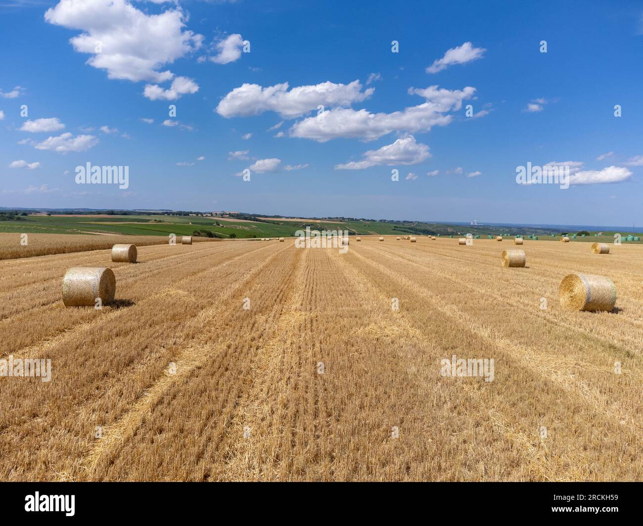 Agriculture in France, yellow haystacks on golden wheat field in July ...