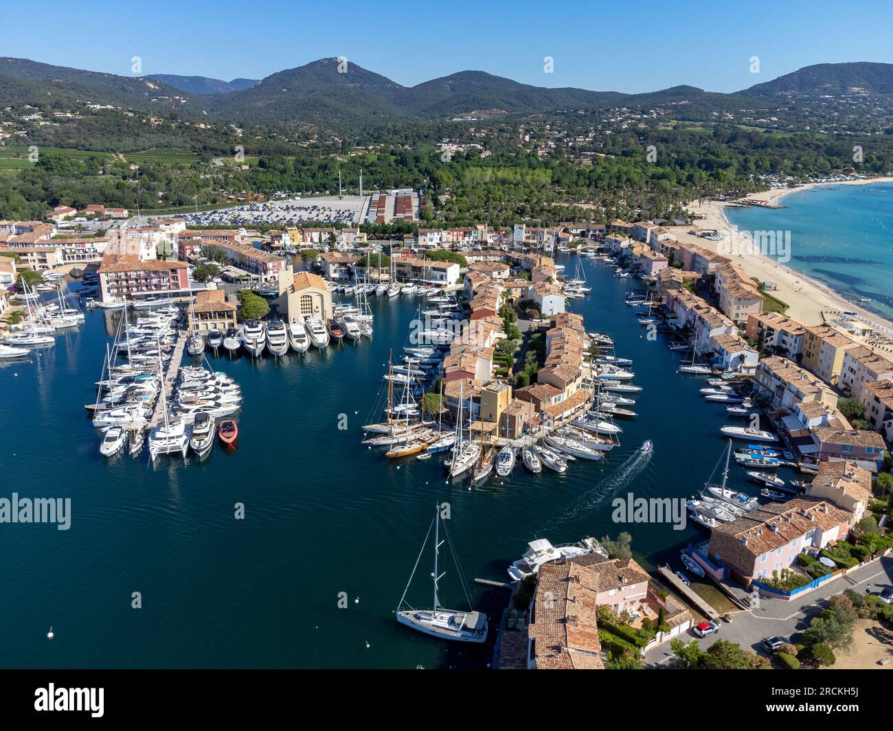 Arial view on blue water of Gulf of Saint-Tropez, boats, houses in Port ...