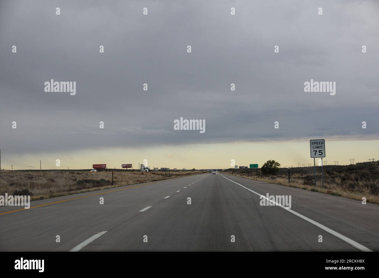 Road leading into the horizon in Western Nebraska prairies with 75 mph ...