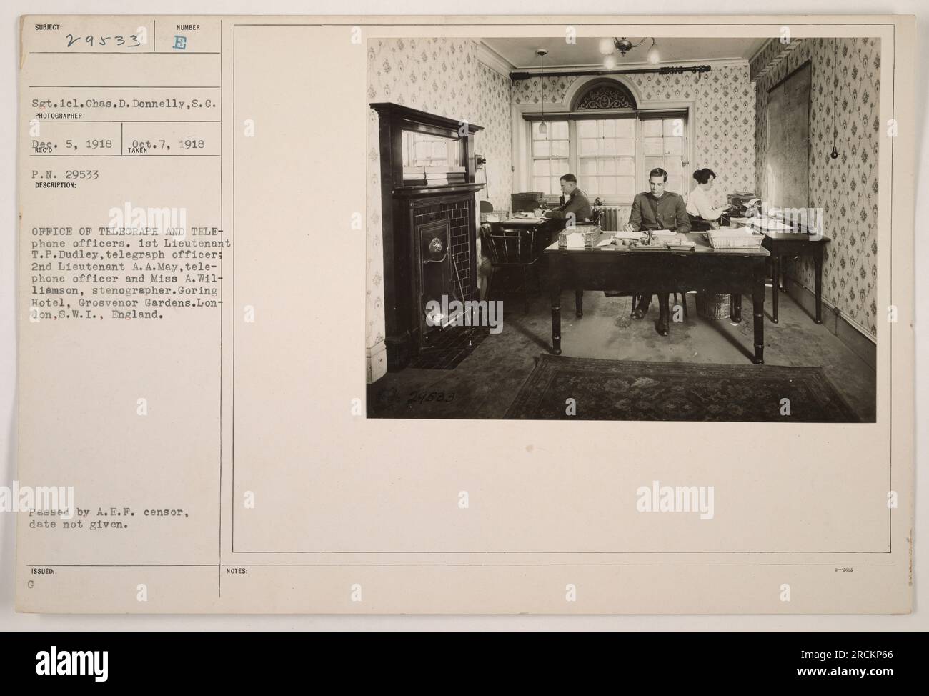 Two American military officers and a stenographer are seen in an office ...