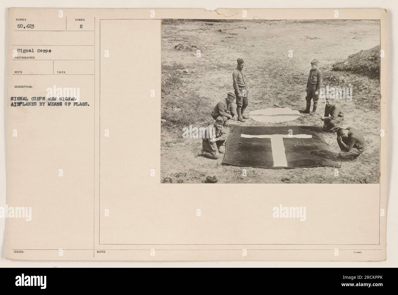 Signal Corps men signaling airplanes using flags during World War One ...