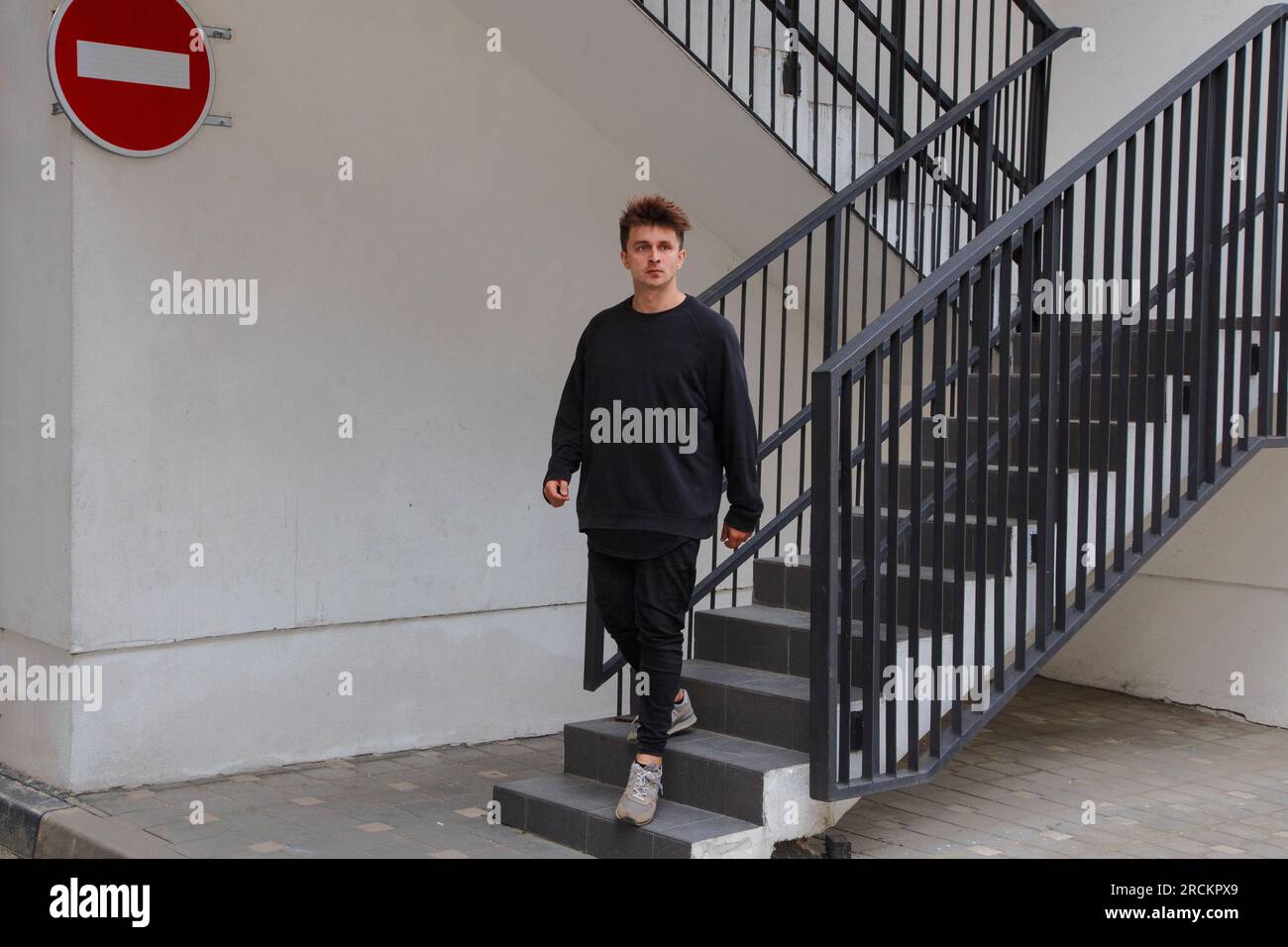 Man coming down stairs hi-res stock photography and images - Alamy