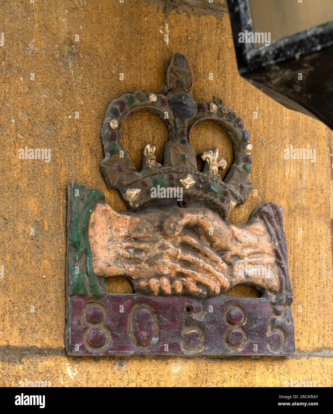 Vintage fire insurance plaque - clasped hands Stock Photo - Alamy