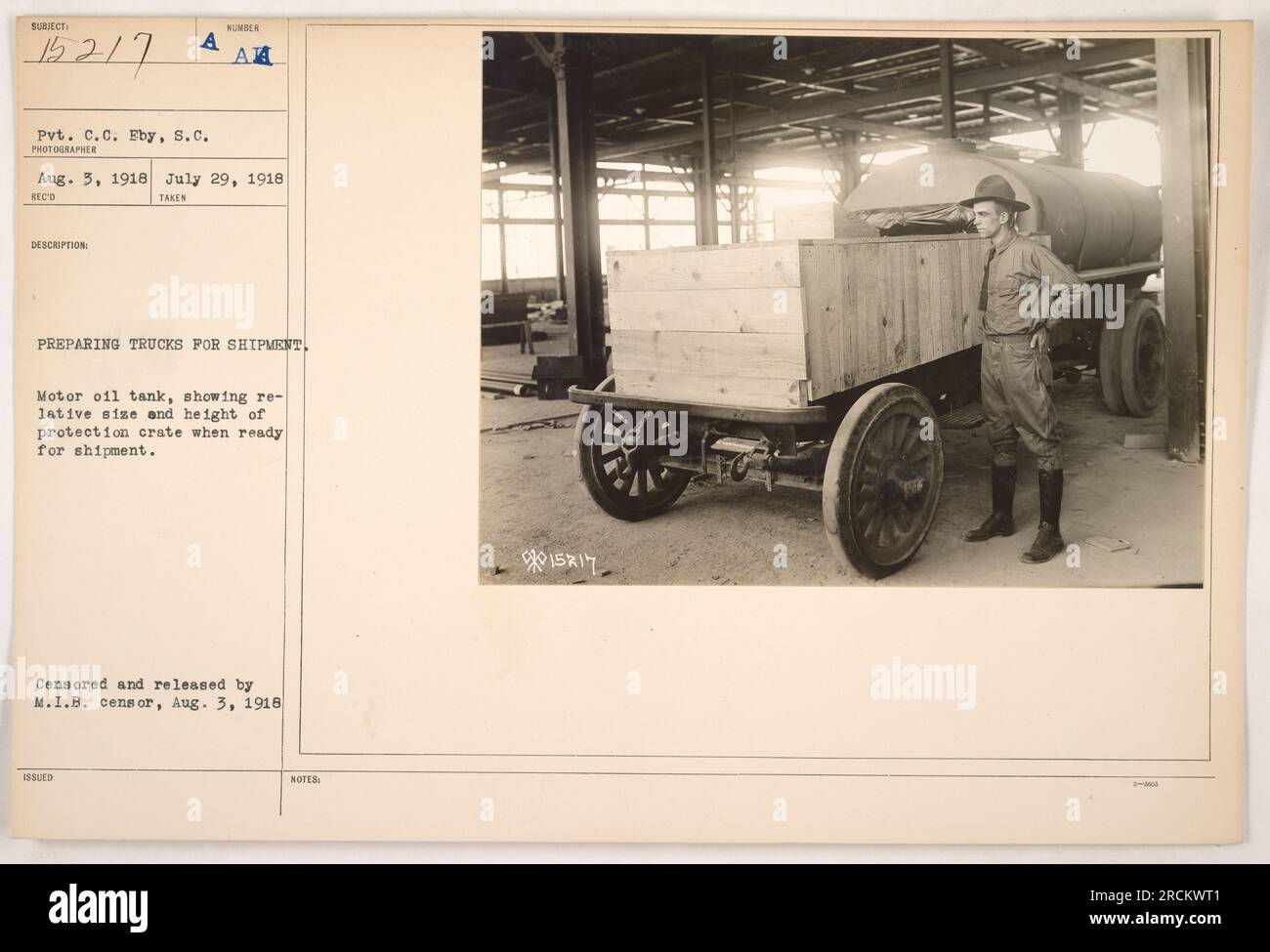 Pvt. C.C. Eby of SC photographed a motor oil tank being prepared for ...