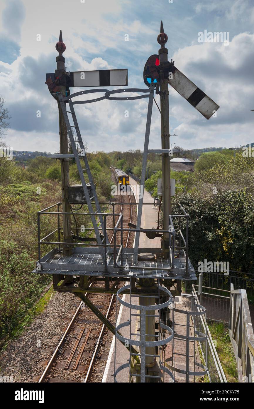 Class 150 sprinter train arriving at Tondu railway station. Wales, UK with a lower quadrant ...