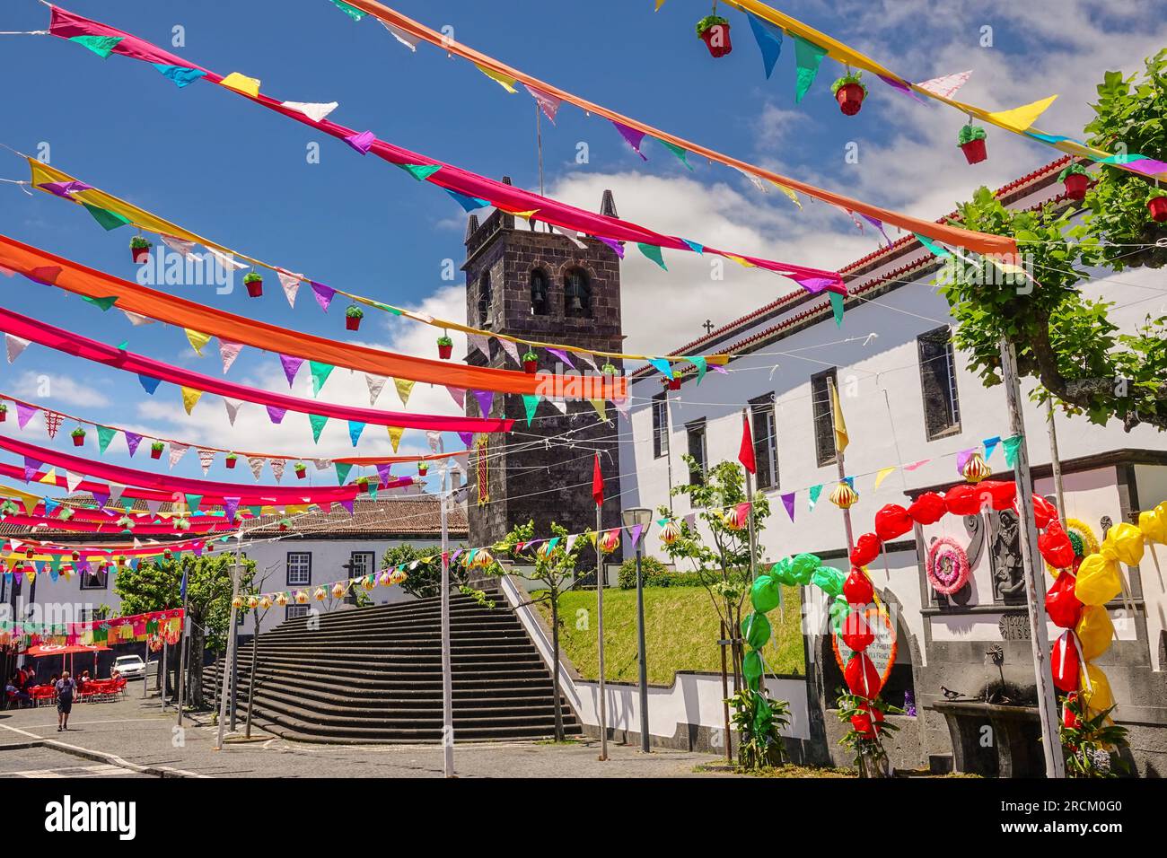 Festive pennants decorate the 16th century Igreja de São Miguel Arcanjo ...