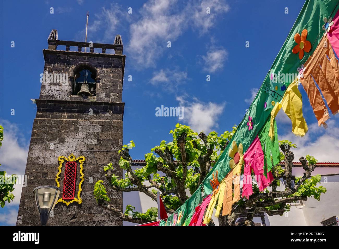 Festive pennants decorate the 16th century Igreja de São Miguel Arcanjo ...