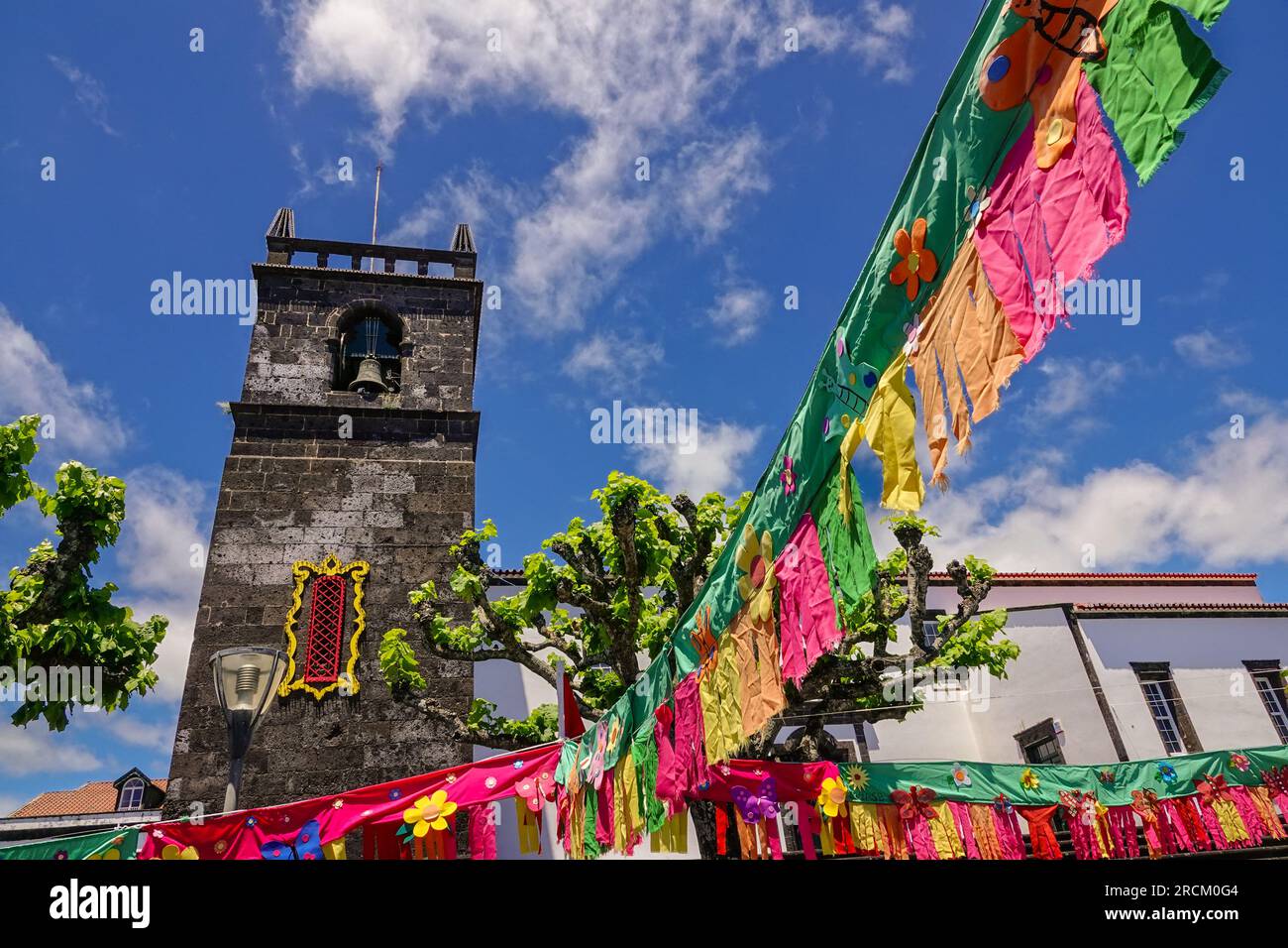 Festive pennants decorate the 16th century Igreja de São Miguel Arcanjo ...