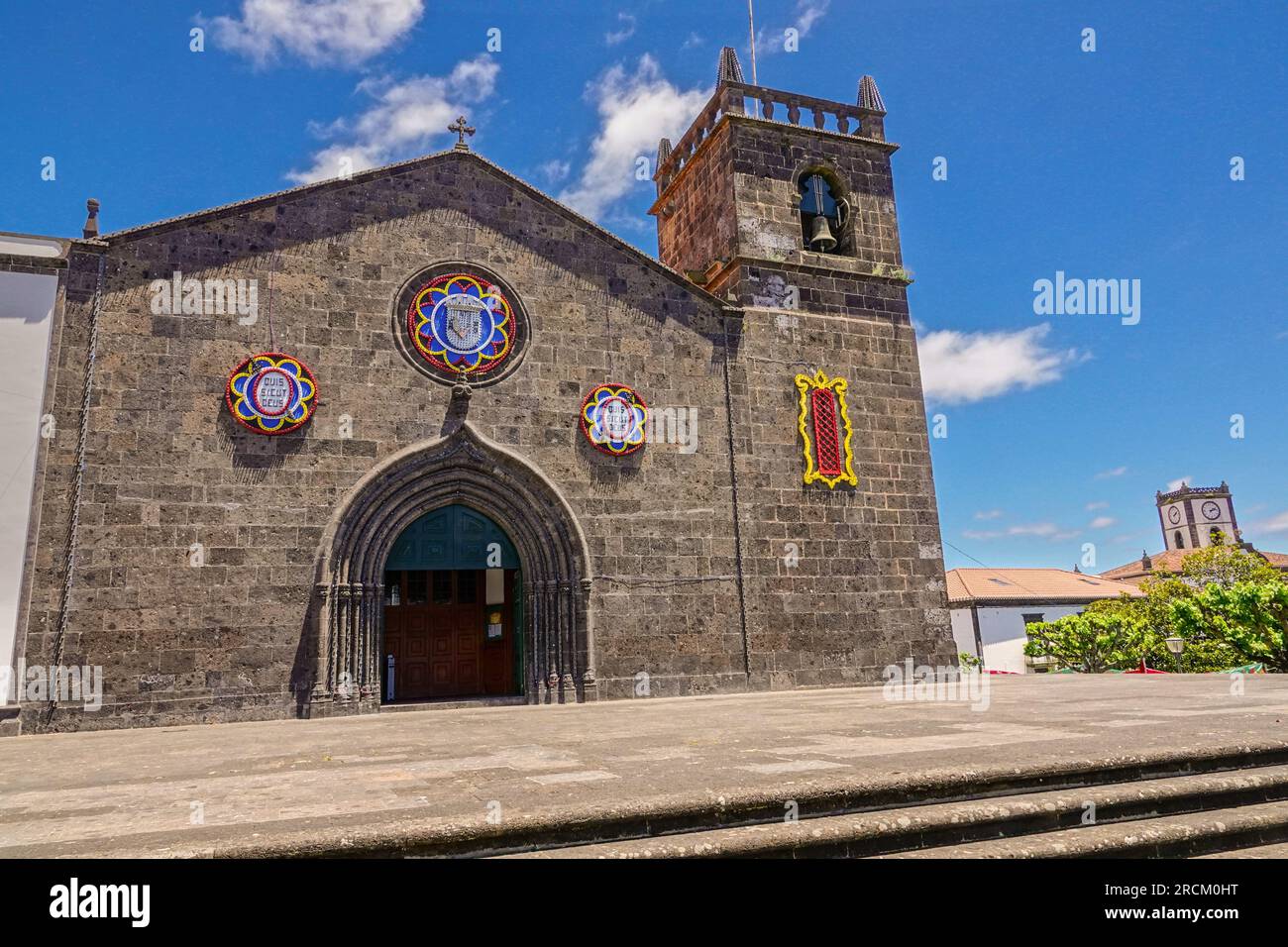 Festive pennants decorate the 16th century Igreja de São Miguel Arcanjo ...