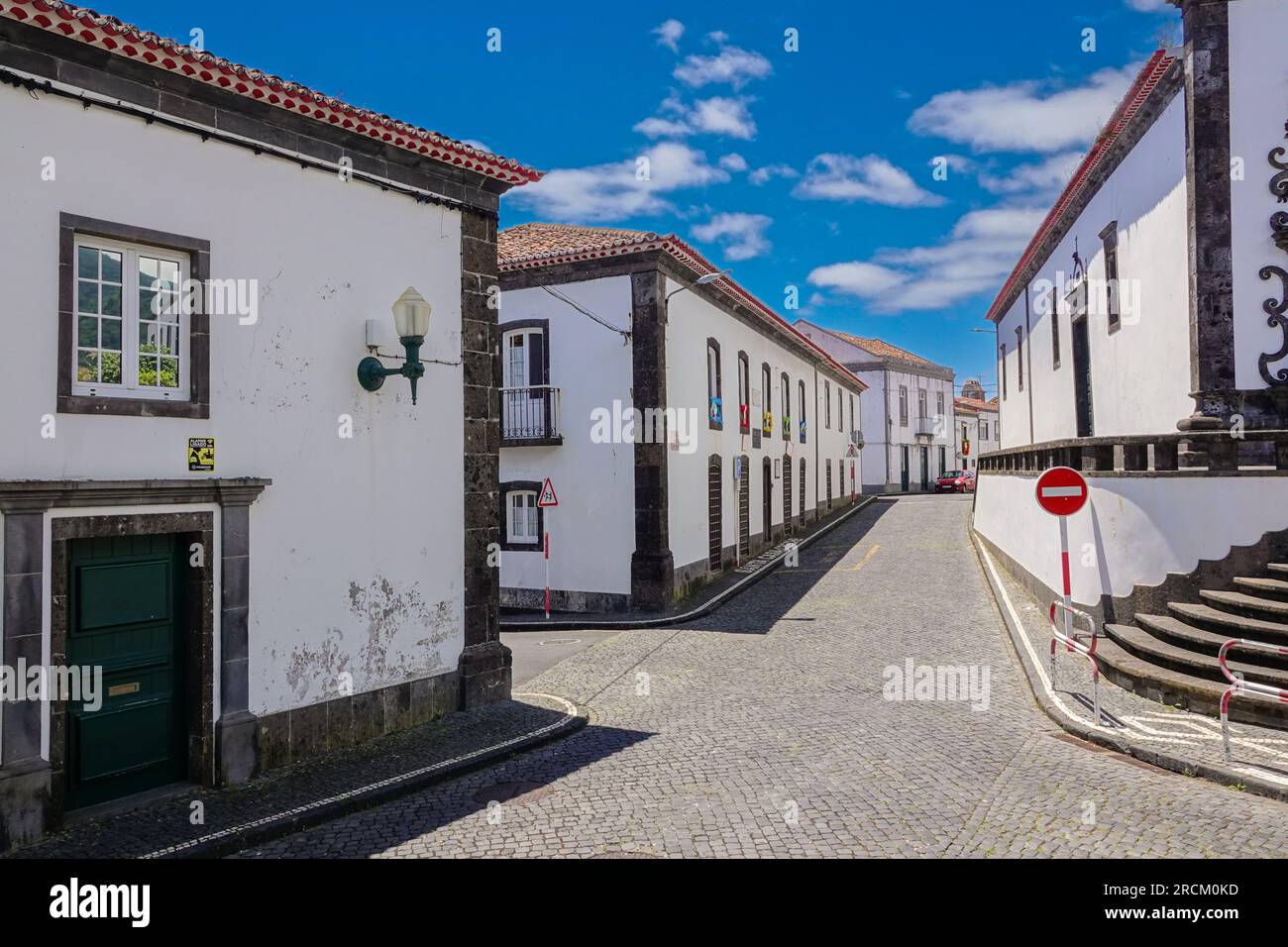 White stone buildings and cobblestone streets in the historic village ...