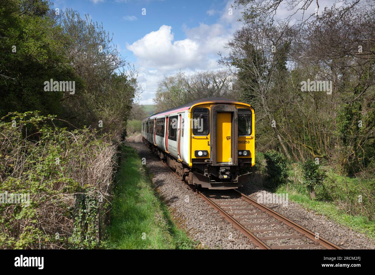 Transport For Wales class 150 diesel multiple unit train on the single track rural branch line ...