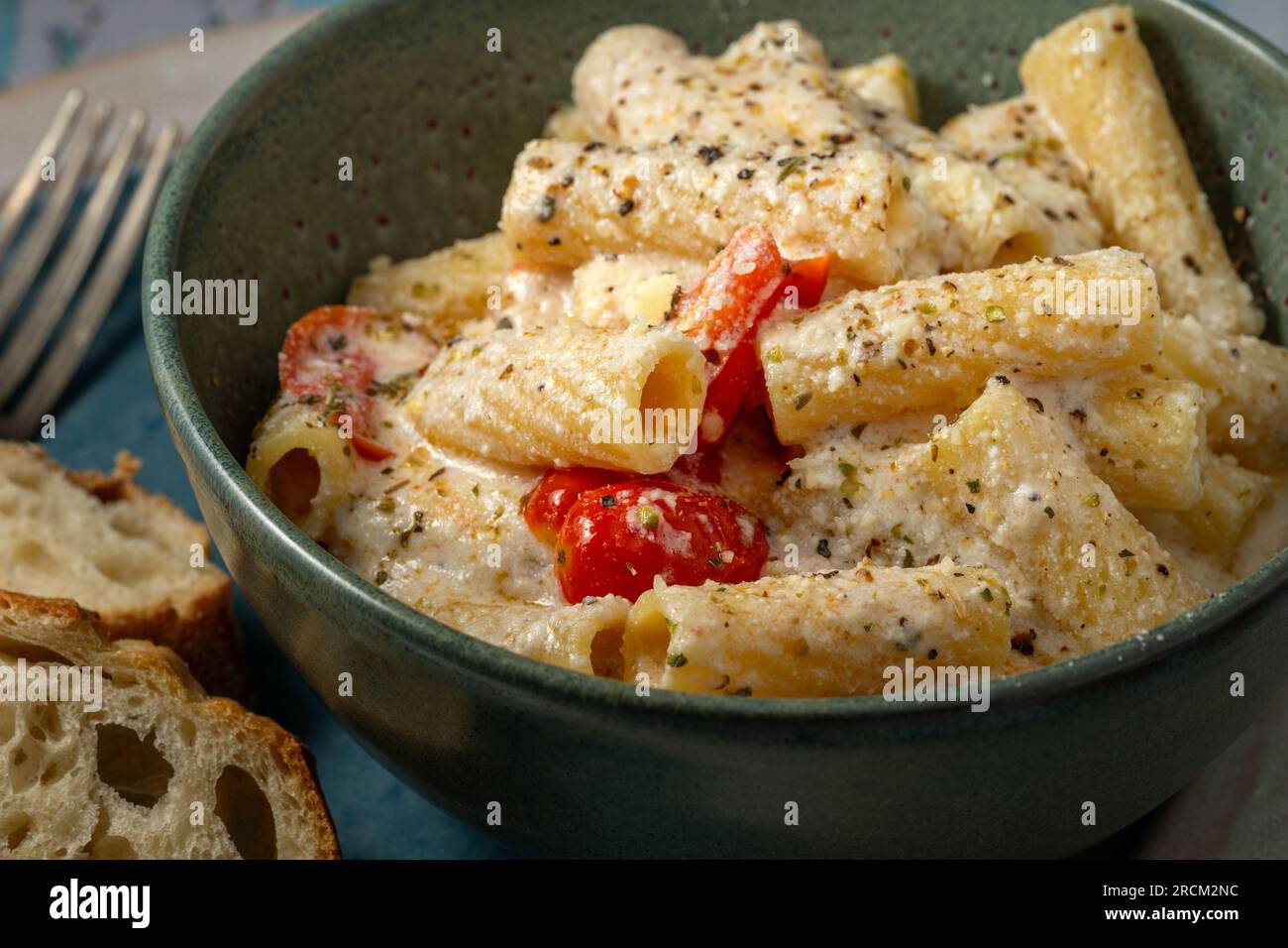 Rigatoni pasta with cherry tomatos and ricotta sauce. Studio shot Stock ...