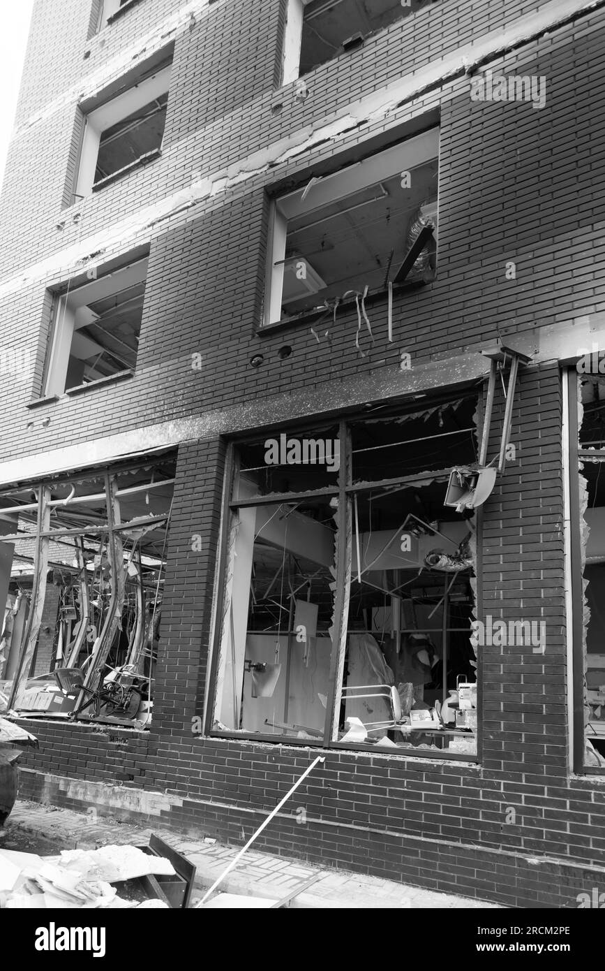 Broken windows of civilian building of bomb explosion. Shards of glass ...