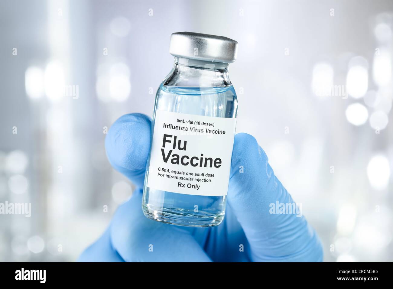 Small drug vial with influenza vaccine Stock Photo - Alamy